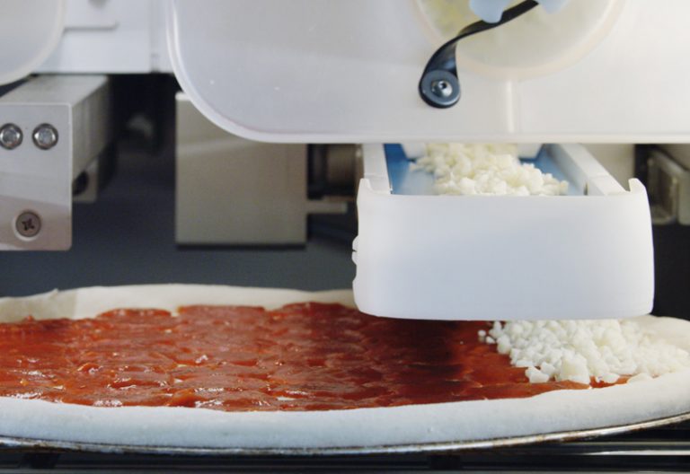 Automated pizza assembly station lands first university contract
